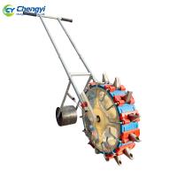China Stainless Steel Hand Push Seeder 7kg Seed Box Precision Sower for Efficient Garden Planting for sale