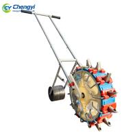 China Polycarbonate Hand Push Seeder 7kg Seed Box Precision Manual Garden Sower Planter Tool for sale