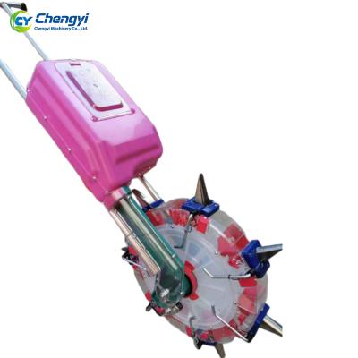 China Ergonomic Walk Behind Hand Push Fertilizer Spreader 14kg Manual Sowing Machine for sale