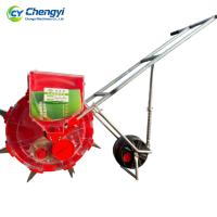 China Steel Manual Seeder Machine Push Seeder 7kg Seed Box Capacity Adjustable Nozzle Spacing for sale