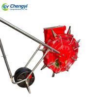 China Steel Manual Seeder Machine Push Seeder 7kg Seed Box Capacity Adjustable Nozzle Spacing for sale