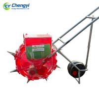 China Steel Manual Seeder Machine Hand Push Planter 7kg Seed Box Adjustable Spacing for sale