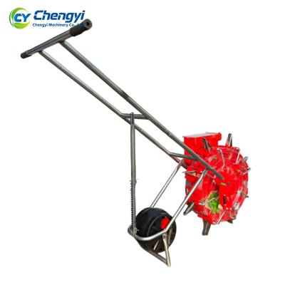 China Steel Manual Seeder Machine Hand Push Planter 7kg Seed Box Adjustable Spacing for sale