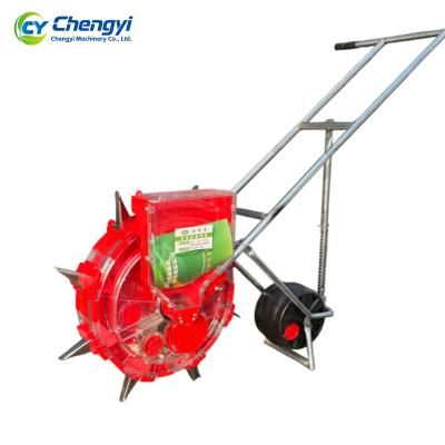 China Heavy Duty Steel Hand Push Seeder 7kg Capacity Manual Sower for Farm Garden for sale
