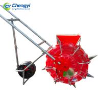 China Heavy Duty Steel Hand Push Seeder 7kg Capacity Manual Sower for Farm Garden for sale