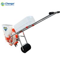 China Iron Manual Seeder Machine With Fertilizing Mechanical Push Planter Durable Dual Purpose Farm Device for sale