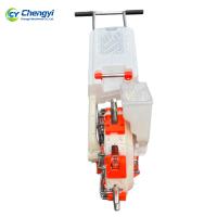 China Iron Manual Seeder Machine With Fertilizing Mechanical Push Planter Durable Dual Purpose Farm Device for sale