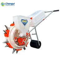 China Manual Seeder Machine with Fertilizing Walking Row Drill 14.5kg Portable Combined Sowing Equipment for sale