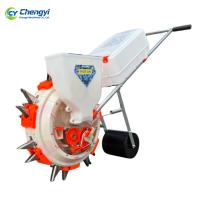 China Manual Seeder Machine with Fertilizing Walking Row Drill 14.5kg Portable Combined Sowing Equipment for sale