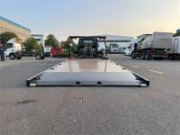China Isuzu 130hp Roll Off Deck Carrier Flatbed Wrecker Truck 5 Tons for sale