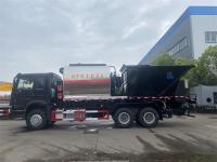 China Sinotruck Howo 38000kg GVW Synchronous Chip Sealer Truck 8000L Asphalt 12000L Gravel for sale
