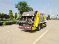 China ISUZU 600P 4x2 6000 Liters Left Hand Drive Garbage Compactor Truck Euro 5 for sale