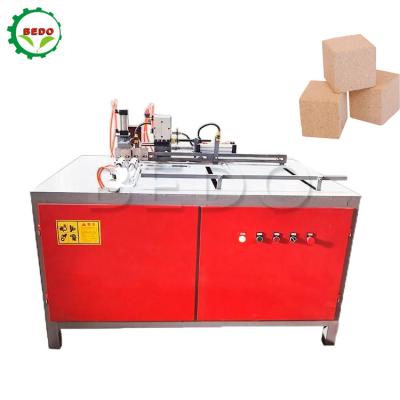 China Automatic Wood Building Block Cutter Foot Pier Machine Sawdust Wood Block Cutter for sale