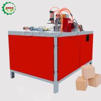 China Automatic Wood Building Block Cutter Foot Pier Machine Sawdust Wood Block Cutter for sale