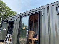 China Second Floor Steel Structure Container Houses Pre-fabricated Components Container Glamping Park Toilet Cafe Shop for sale