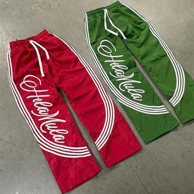 China Nylon Windbreaker Side Stripes Sweatpants Lightweight Baggy Wide Leg Jogger Silk Screen Printing Men Quick Dry Track Pants for sale