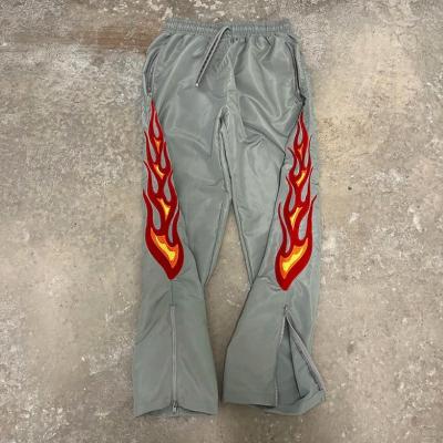 China Casual Graphic Embroidered Patches Men Streetwear Joggers Stacked Flare Half Zipper for sale