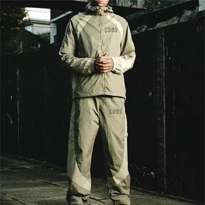 China Custom Embroidery logo Polyester Waterproof Tracksuit for Men Patchwork Nylon Windbreaker Jacket Jogging Pants Tracksuit for sale