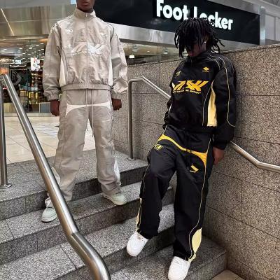 China Custom Logo Lightweight Casual Nylon Trachsuit Zip up Jacket and Baggie Sweatpants Suit Unisex Windbreaker Streetwear Tracksuit for sale