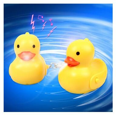 China New creative gift cartoon animal yellow duck led light keychain keyrings with sound for sale