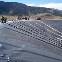 China Textured HDPE Geomembrane 0.75-3mm Thickness Anti-Puncture Slope Liner 50-100m Length for sale