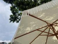 China Hand Woven Tassel Outdoor Column Straight Umbrella with Wood Grain Aluminum Frame for sale