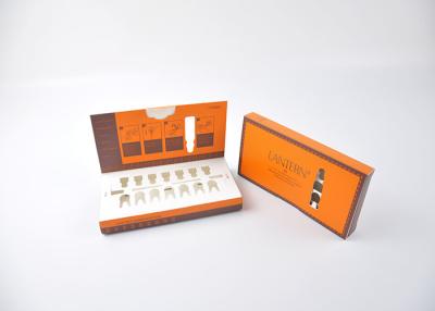 China 350g Coated Paper Foldable Cosmetic Packaging Boxes Packing Oil Bottle With Paper Insert for sale