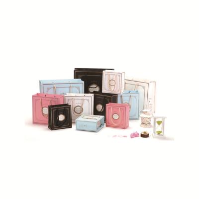China Mini Paper Gift Bags With Handles Nylon Matte Finishing Custom Company Logo for sale