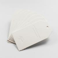 China Matt Cardboard Paper Hang Tags Garment Accessories Embossed  For Clothing Own Logo for sale