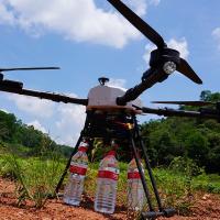China 15kg Freight Capacity Professional Carrier Drone with Drop Thrower and 1000 Nits Display for sale