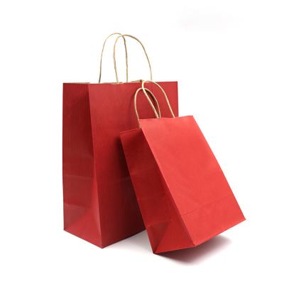 China OEM Custom Recycled Kraft Paper Shopping Bags 100gsm 10kg Capacity with Twisted Handles for sale