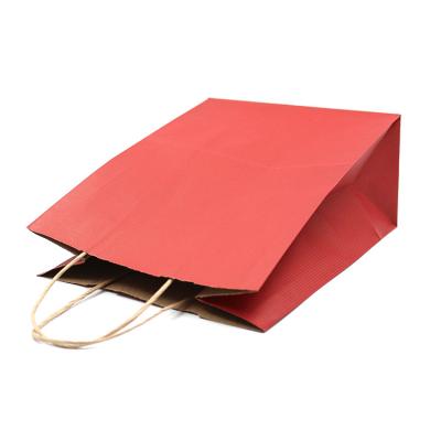China 100-150gsm Kraft Paper T Shirt Bags Compostable Recyclable 10kg Capacity for sale