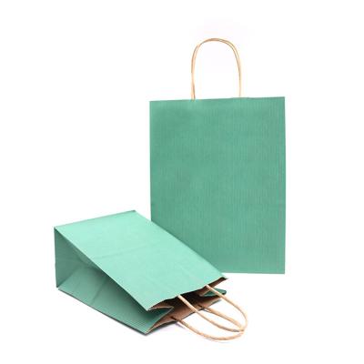 China Custom Plain Kraft Paper T Shirt Bags with Handles UV Coating Spot Varnishing 110gsm for sale