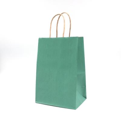 China Custom Kraft Paper T-Shirt Bags with Handles CMYK Pantone Printing 30x40cm for sale