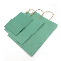 China Custom Kraft Paper T-Shirt Bags with Handles CMYK Pantone Printing 30x40cm for sale