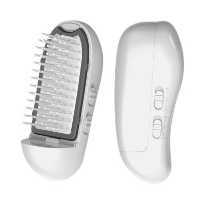 China 450mAh Battery IONIC Hair Brush Vibration Blue Light Hair Brush for sale