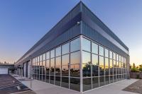 China Prefabricated Commercial Steel Building with Q235/Q355 Steel Frame and 1.8-3.0mm Purlin Thickness for Industrial Applications for sale