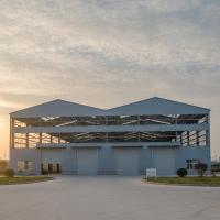 China Double Slope Roof Steel Structure Warehouse Built Using Q420B Steel Material Designed To Last More Than 50 Years Providing Storage Space for sale