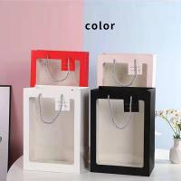 China Custom 250gsm C1S Paper Jewelry Bag with Window and Nylon Handle UV Stamp for sale
