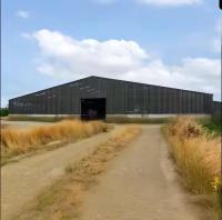 China Farmhouse Style Steel Structure Cow Shed Prefabricated Temporary Storage Buildings for sale