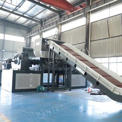 China Continuous Operation Dual Shaft Industrial Shredder for Plastic Film Pp Pe Bottles Rubber Tires With Safety Grating for sale