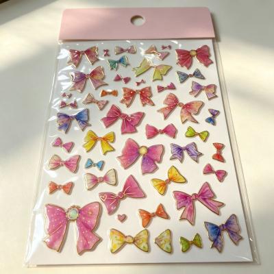 China Custom Gold Foil Epoxy Stickers with Bow Designs for Decoration for sale