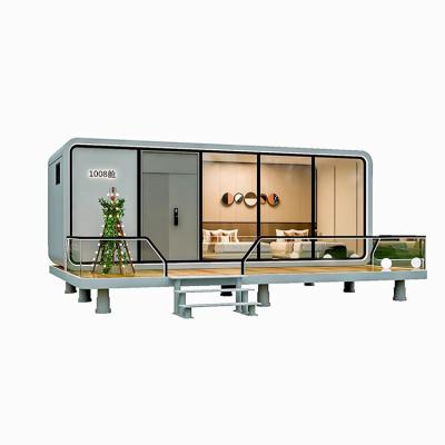 China Prefabricated Apple Cabin House with Metal Carved Panel Exterior Wall and Electrical System for sale
