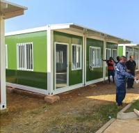 China Detachable Container House 50mm Rock Wool Sandwich Panel Aluminum Alloy Door Prewired for sale