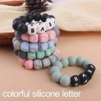 China Bpa Free Natural Rubber Silicone Pacifier  Baby Letter Chew Teething Teether Toy for sale