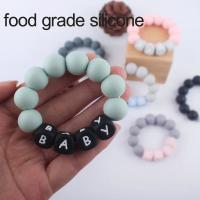 China Bpa Free Natural Rubber Silicone Pacifier  Baby Letter Chew Teething Teether Toy for sale