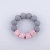 China Bpa Free Natural Rubber Silicone Pacifier  Baby Letter Chew Teething Teether Toy for sale