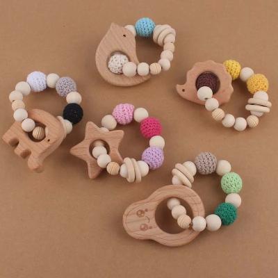 China Wholesale Baby Crochet Beads Teether Shower Gift Wooden Ring Rattles Baby Silicone Teething Bracelet for sale