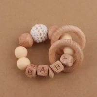 China Baby Teething Toys Rattle Soft Bpa Free Cartoon Wood Baby Teether Ring Kids Food Grade Baby Silicone Teether for sale
