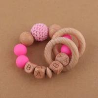 China Baby Teething Toys Rattle Soft Bpa Free Cartoon Wood Baby Teether Ring Kids Food Grade Baby Silicone Teether for sale